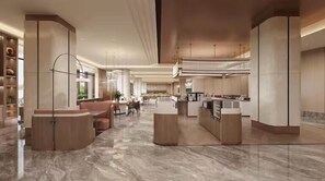 Um hall amplo com área de estar central, balcão de recepção e cozinha.