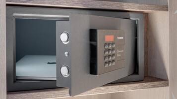 Um cofre com teclado numérico e um compartimento interno.