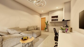 Uma sala de estar moderna com um sofá, uma mesa de centro e um laptop em uma escrivaninha.