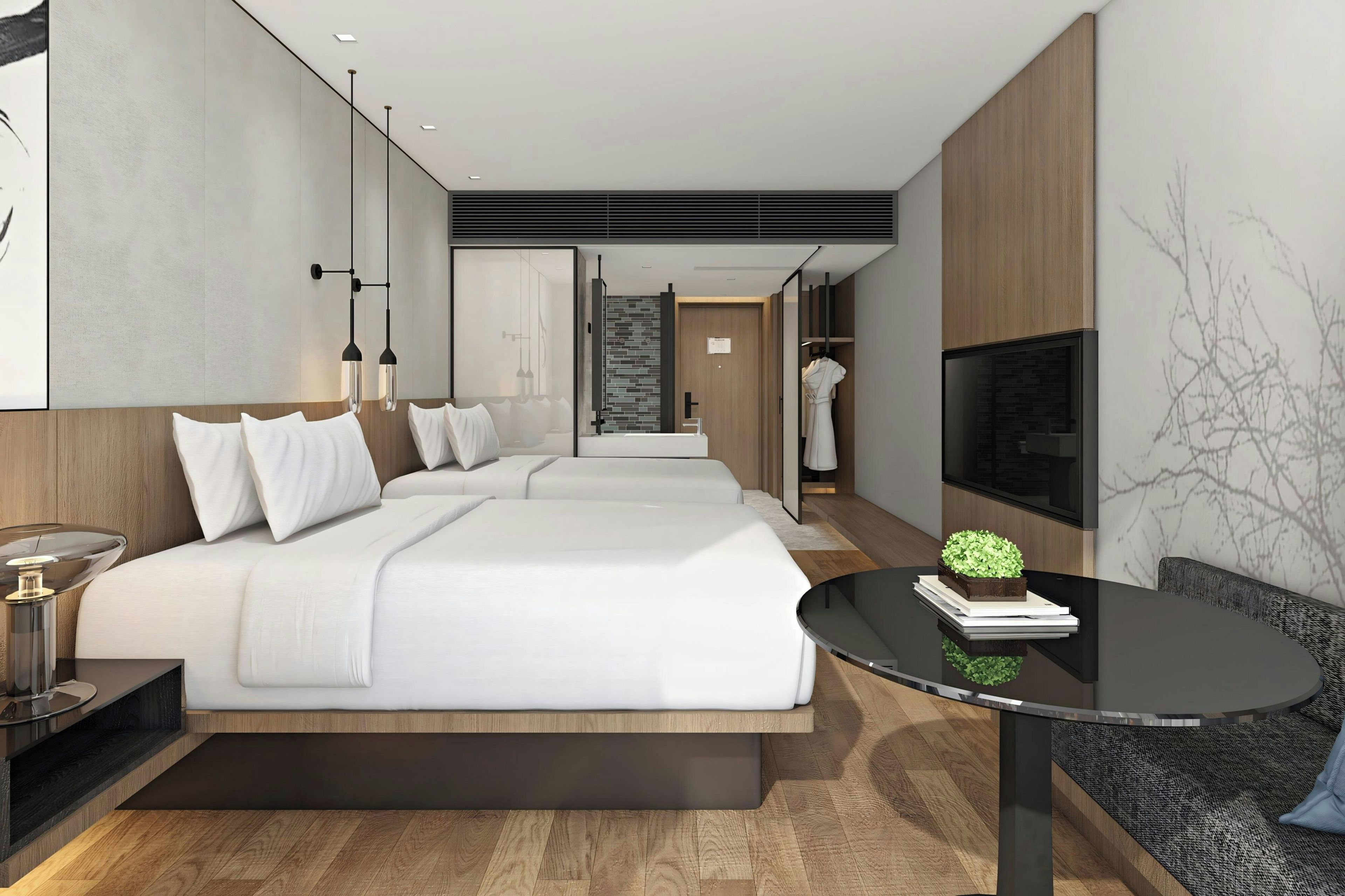 Quarto de hotel moderno com uma cama grande, mesas de cabeceira, uma mesa redonda e uma televisão.