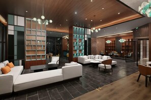 Um hall moderno com um sofá seccional, poltronas, uma mesa de centro e uma estante.