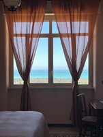 Quarto casal ou duplo conforto, vista para o mar | Roupas de cama premium