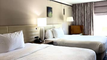Roupas de cama premium, cortinas blackout, Wi-Fi de cortesia