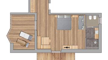 Planta baixa de um quarto de hotel com piso de madeira, sofá, cama, escrivaninha, cadeira, mesa pequena e banheiro com vaso sanitário e pia.