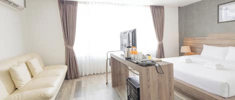 Deluxe Premier Room | Escrivaninha, Wi-Fi de cortesia, roupa de cama