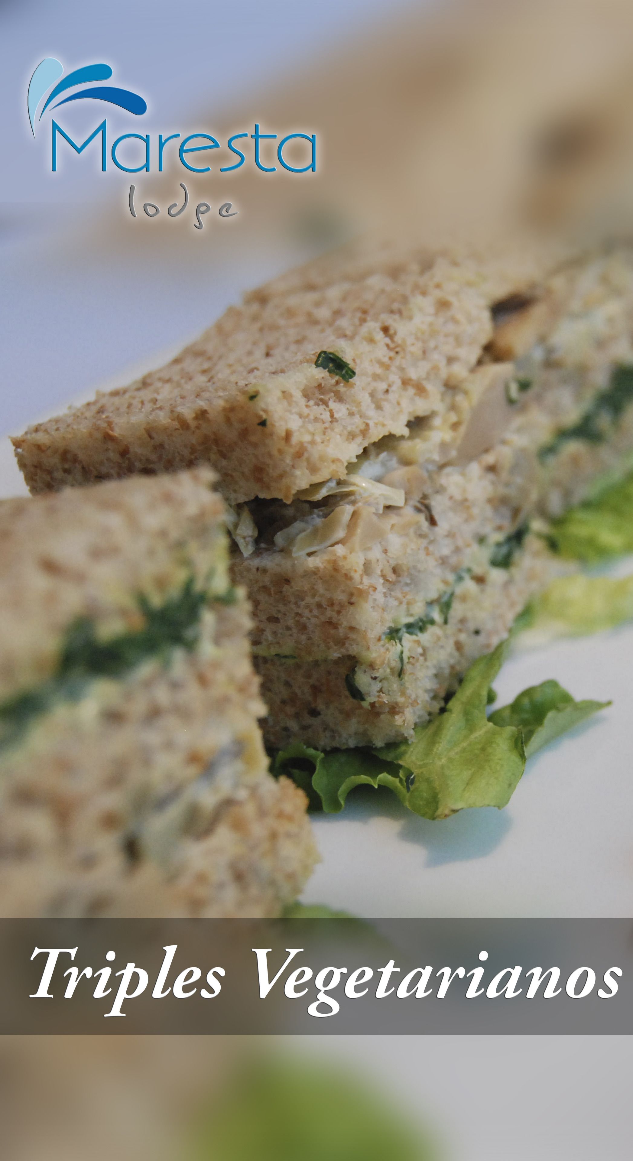 Um sanduíche com o texto "Triples Vegetarianos" e "Maresta Lodge" visível.