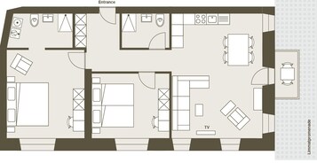 Planta baixa de um hotel com televisão na sala de estar, cozinha, sala de jantar e banheiro.