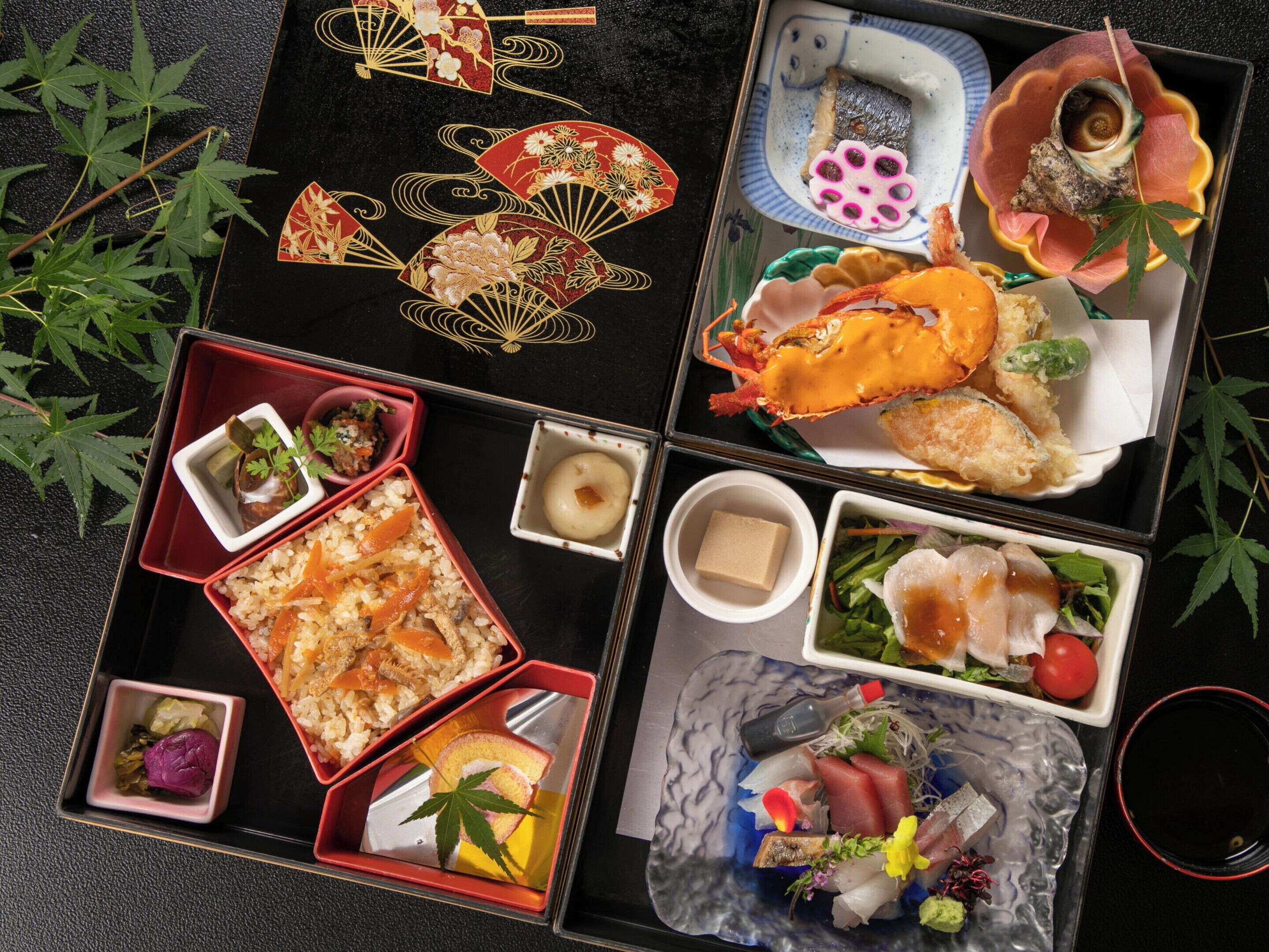 Uma refeição tradicional japonesa com diversos pratos, incluindo sushi, sashimi e arroz.