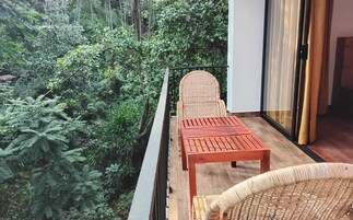 Quarto Duplo Deluxe, 1 quarto, varanda, vista para o jardim | Vista para o jardim