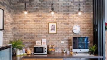 Quarto luxo, 1 cama King e sofá-cama, cozinha americana, vista para a cidade | Cozinha compartilhada