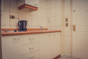 Apartamento | Cozinha privada | Um frigorífico/congelador grande, uma placa de cozinha 
