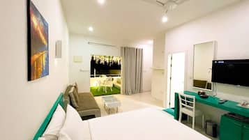 Suíte, terraço, vista para o oceano | 1 quarto, roupas de cama premium, frigobar, cofres nos quartos