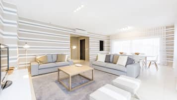 Apartamento luxo, 3 quartos | Área de estar | TV de tela plana