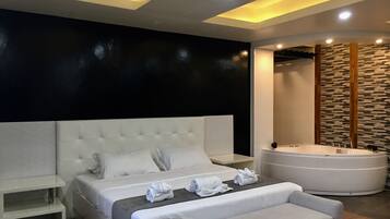 Suíte premium, 1 cama King | Roupas de cama premium, edredons de pluma, cortinas blackout