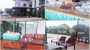 Um edifício moderno com restaurante, incluindo área externa e mesa de buffet.