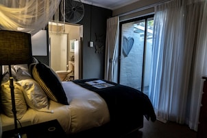 Quarto casal | Vista para o jardim