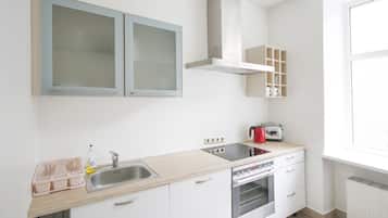 Apartamento Clássico, 2 quartos | Cozinha privada | Um frigorífico/congelador grande, um forno, uma placa de cozinha