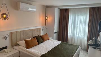 Minibar, secretária, quartos insonorizados, ferro/tábua de engomar