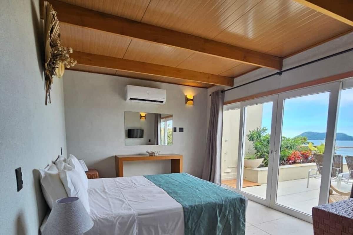 Quarto Elite, pátio, vista para o mar | Minibar, cofre no quarto, quartos insonorizados