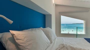 Suíte júnior, terraço, vista para o mar | 1 quarto, roupas de cama premium, frigobar, cofres nos quartos