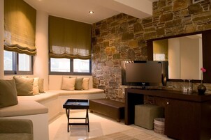 Quarto casal | Área de estar | TV de tela plana