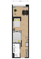 Quarto com 3,46 metros de comprimento, com cama, mesa de cabeceira e um pequeno espaço de estar.