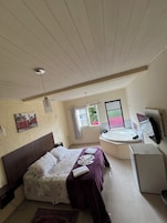 Suíte premium | 1 quarto, roupas de cama premium, frigobar, cortinas blackout