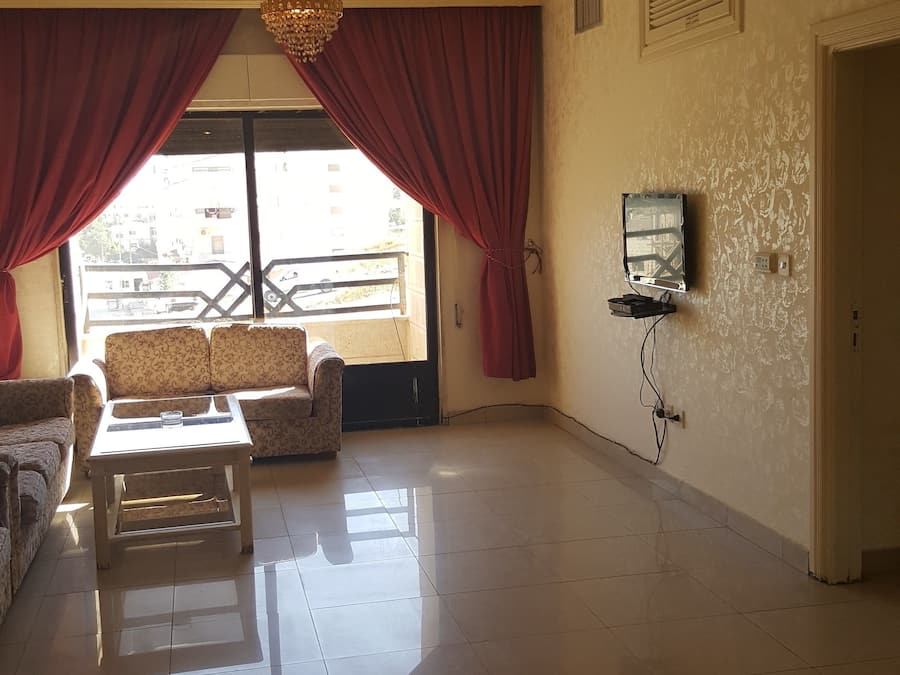 Apartamento, 1 quarto | Sala de estar | TV