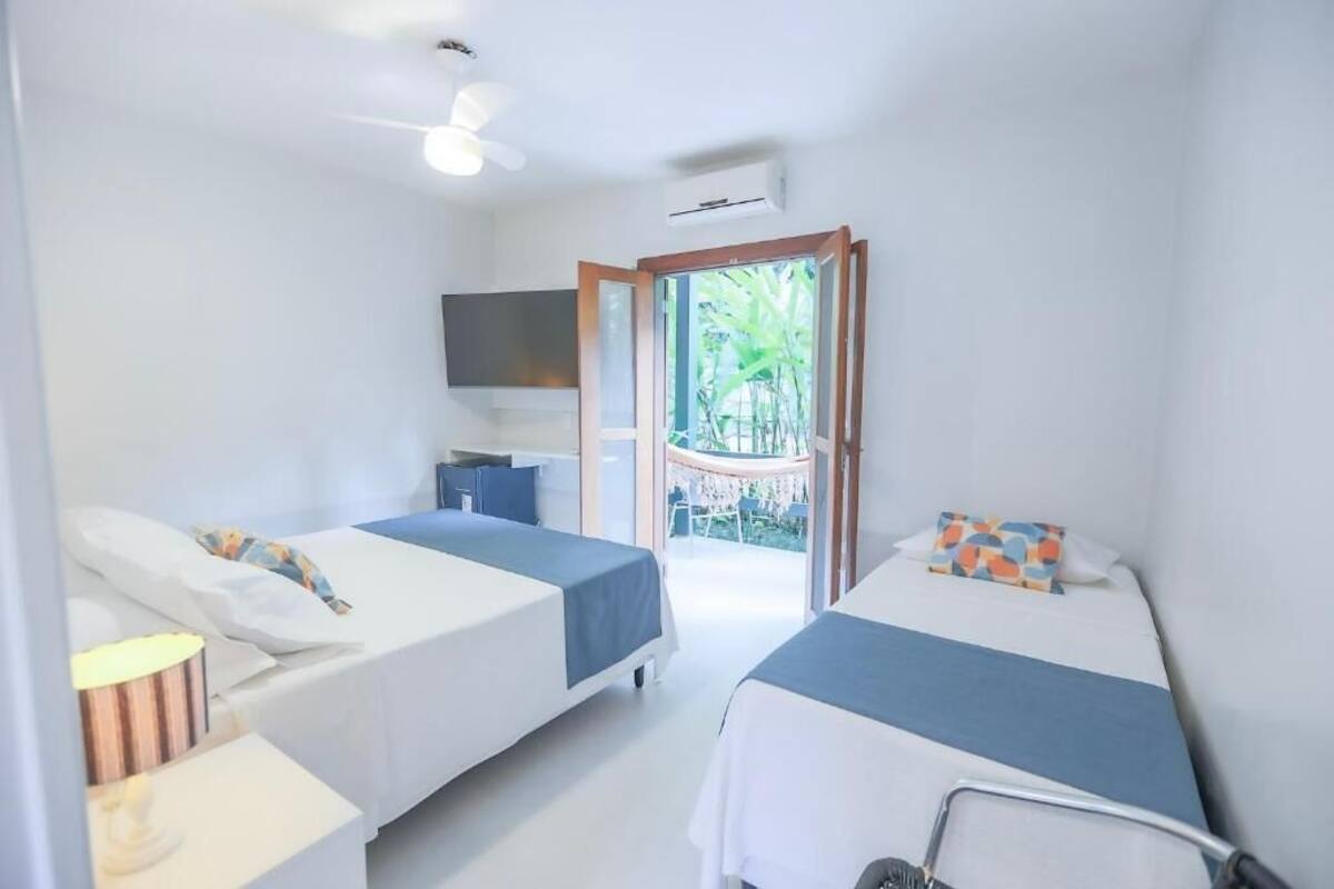 Quarto triplo | Frigobar, cortinas blackout, Wi-Fi de cortesia