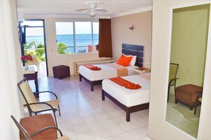 Habitación Premium, Vista al Mar | Cofres nos quartos, escrivaninha, roupa de cama
