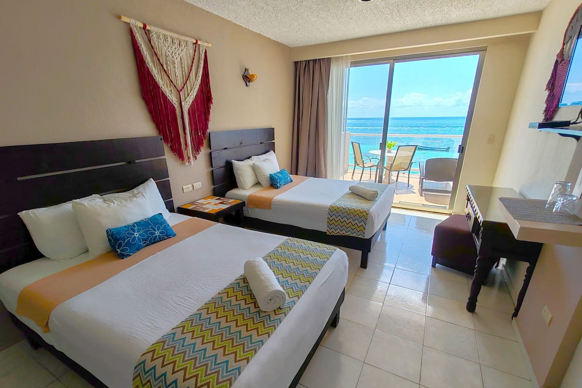 Habitación Premium, Vista al Mar | Cofre no quarto, secretária, roupa de cama fornecida