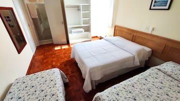 Quarto quádruplo | Frigobar, roupa de cama