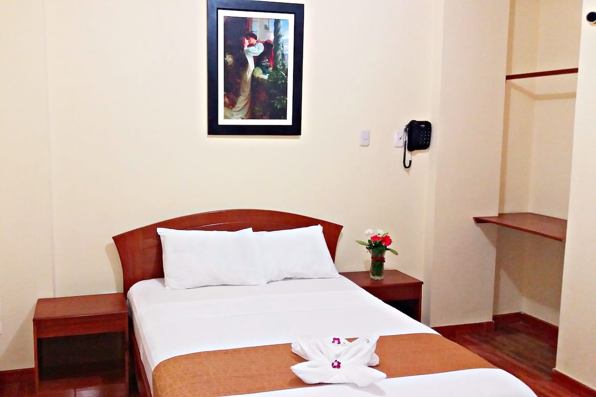 Quarto solteiro, vista para o jardim | Escrivaninha, camas extras/dobráveis (sobretaxa), Wi-Fi de cortesia