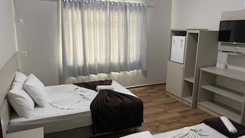 Quarto quádruplo standard | Wi-Fi de cortesia, roupa de cama