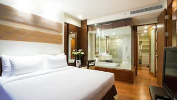 Suíte executiva, 1 quarto | 1 quarto, roupas de cama premium, cofres nos quartos, escrivaninha