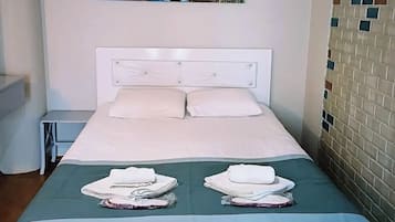 Quarto Quádruplo, 2 quartos | Ferro/tábua de engomar, Wi-fi grátis, roupa de cama fornecida