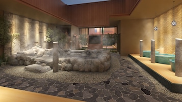 Uma área de spa moderna com uma banheira de pedra quente, um deck de madeira e vista para o horizonte da cidade.