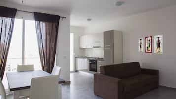 Apartamento, 1 quarto, banheiro privativo | Área de estar