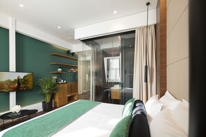 Suíte júnior | Roupas de cama premium, frigobar, cofres nos quartos, cortinas blackout
