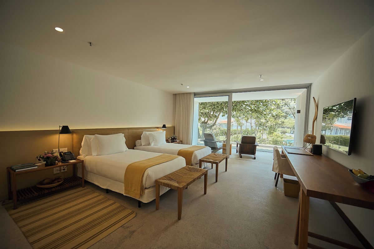 Quarto superior, 2 camas de solteiro, vista para o jardim | Cofres nos quartos, Wi-Fi de cortesia, roupa de cama