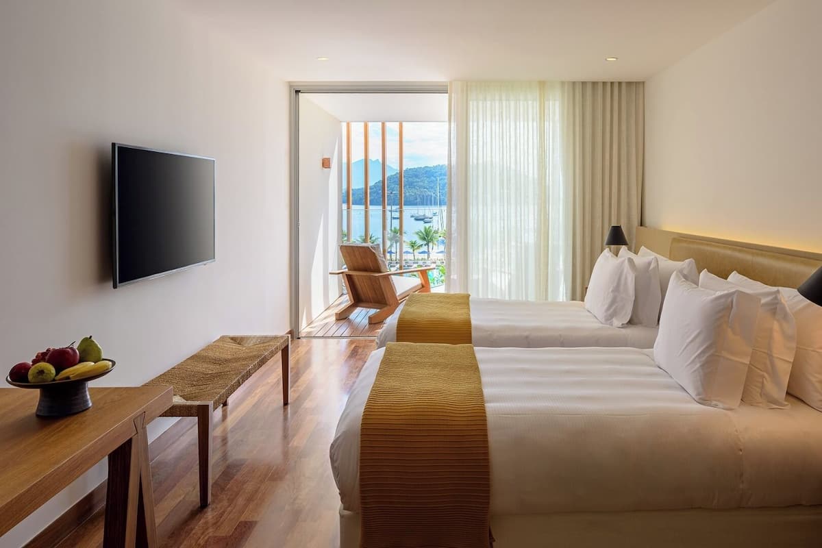 Quarto superior, 2 camas de solteiro, vista parcial para o oceano | Cofres nos quartos, Wi-Fi de cortesia, roupa de cama