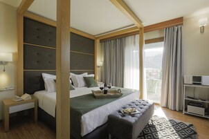 Suíte executiva | Frigobar, cofres nos quartos, escrivaninha, cortinas blackout