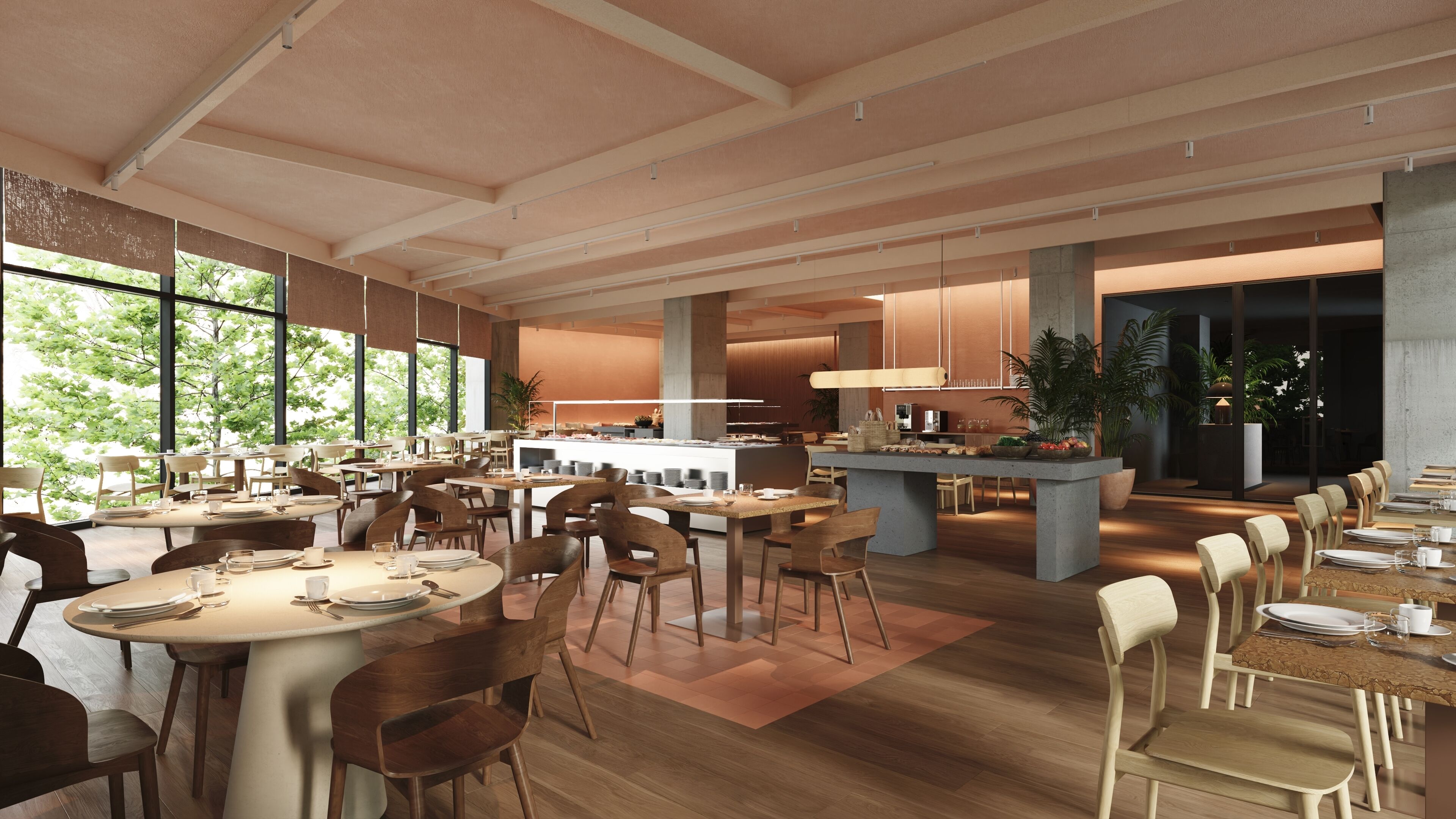 Um restaurante espaçoso com pé direito alto, grandes janelas e uma ilha central com cozinha. Mesas dispostas ao redor da ilha, com cadeiras e mesas de jantar por todo o espaço.