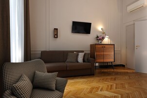 Suíte júnior | Área de estar | TV de tela plana