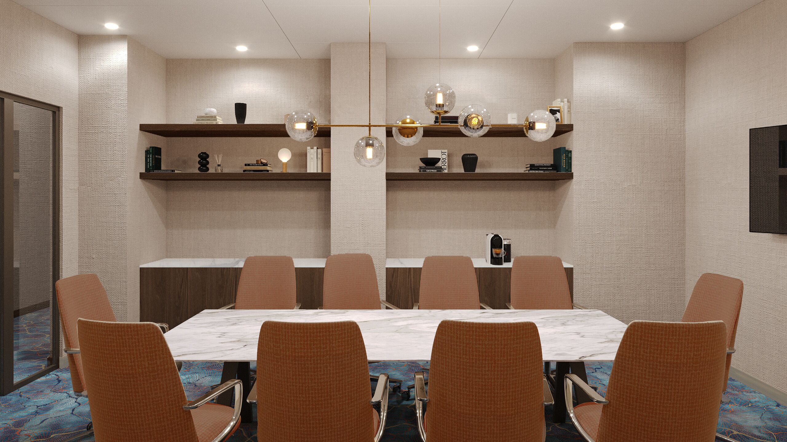 Uma sala de conferência com uma mesa de mármore, cadeiras marrons, uma máquina de café e um lustre moderno.