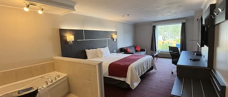 Quarto standard, 1 cama King, para não fumantes | Área de estar | TV 32 polegadas com canais a cabo