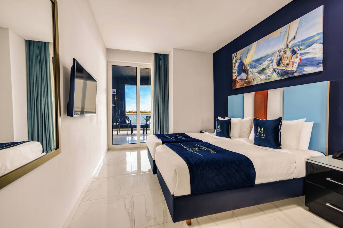 Superior Sea View Two Bedroom Suite (Round Building) | Lençóis de algodão egípcio, roupa de alta qualidade, minibar 