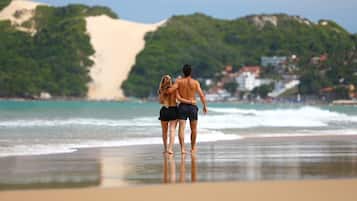 Na praia, toalhas de praia