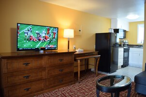 Suíte executiva, 1 quarto, para não fumantes, cozinha americana | Sala de estar | TV de tela plana