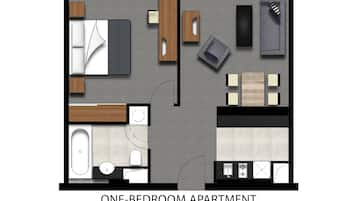 Planta de um apartamento de um quarto, incluindo quarto, banheiro, cozinha compacta e sala de estar.